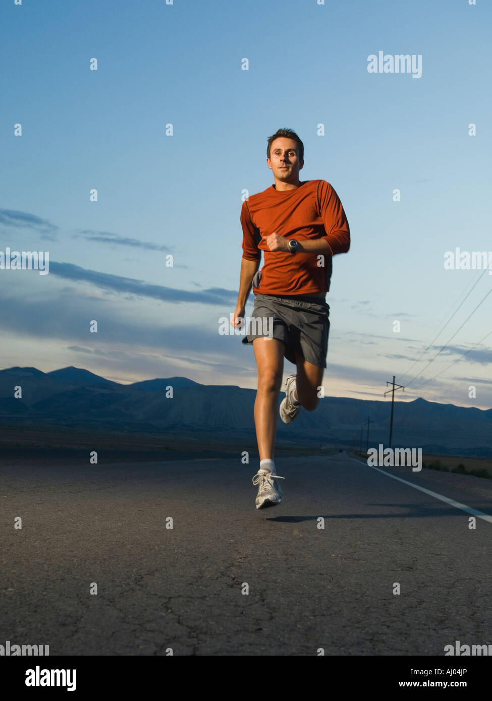 Man in athletic gear running Stock Photo - Alamy