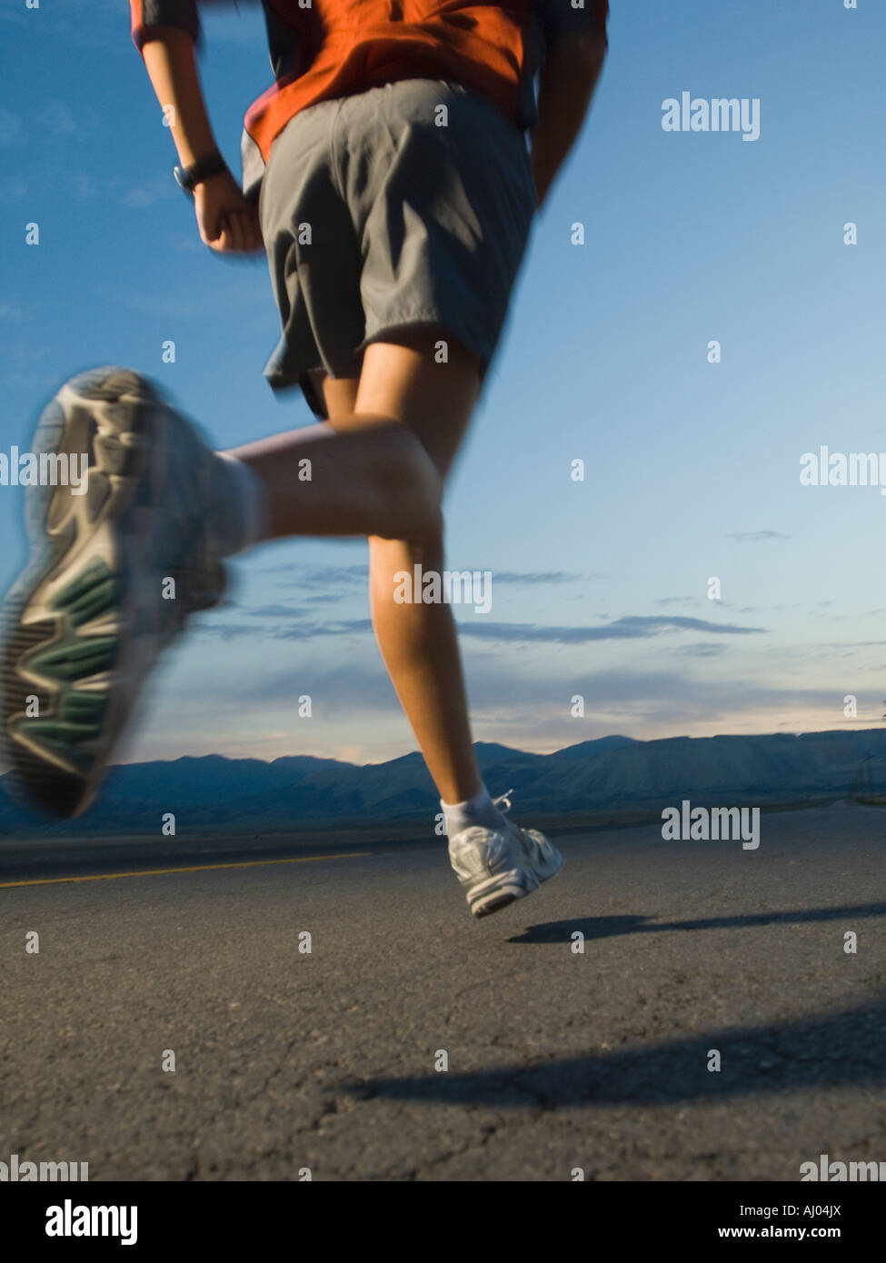 Man in athletic gear running Stock Photo - Alamy