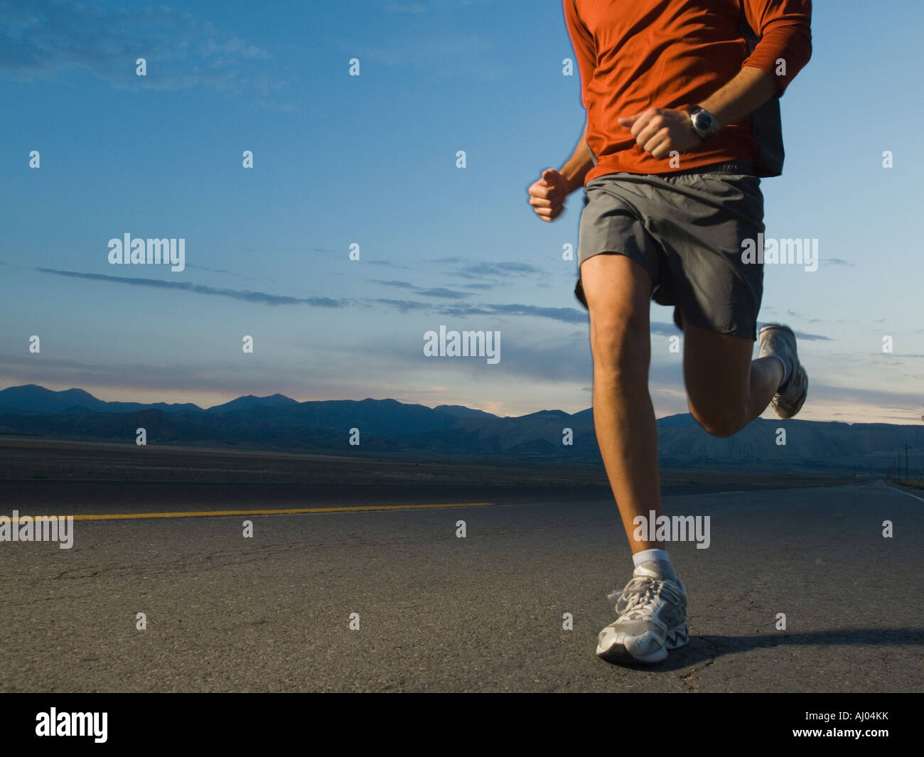 Man in athletic gear running Stock Photo - Alamy