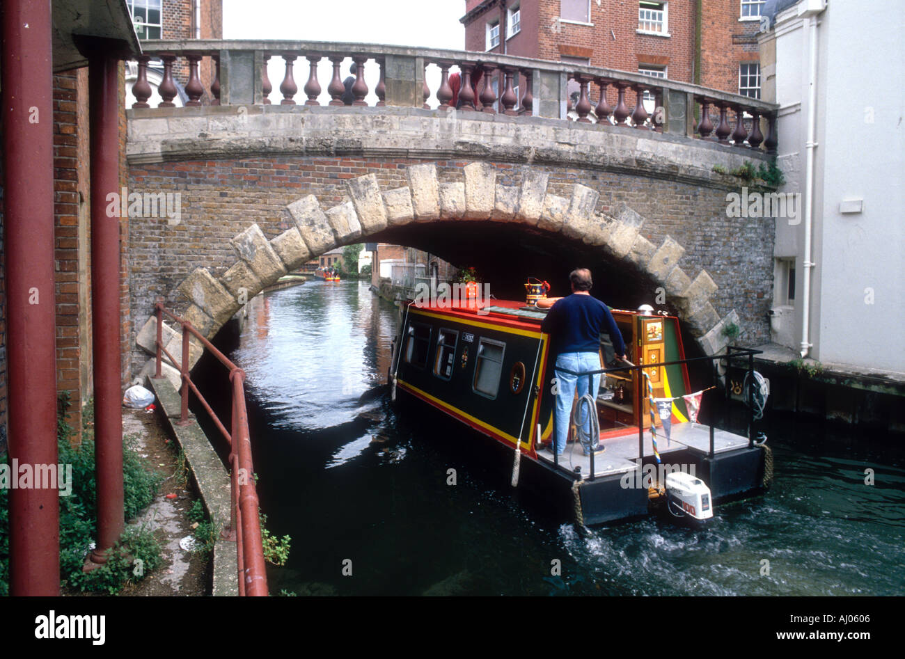 A outboard motor narrowboat at Town Bridge on the Kennet and Avon Canal ...