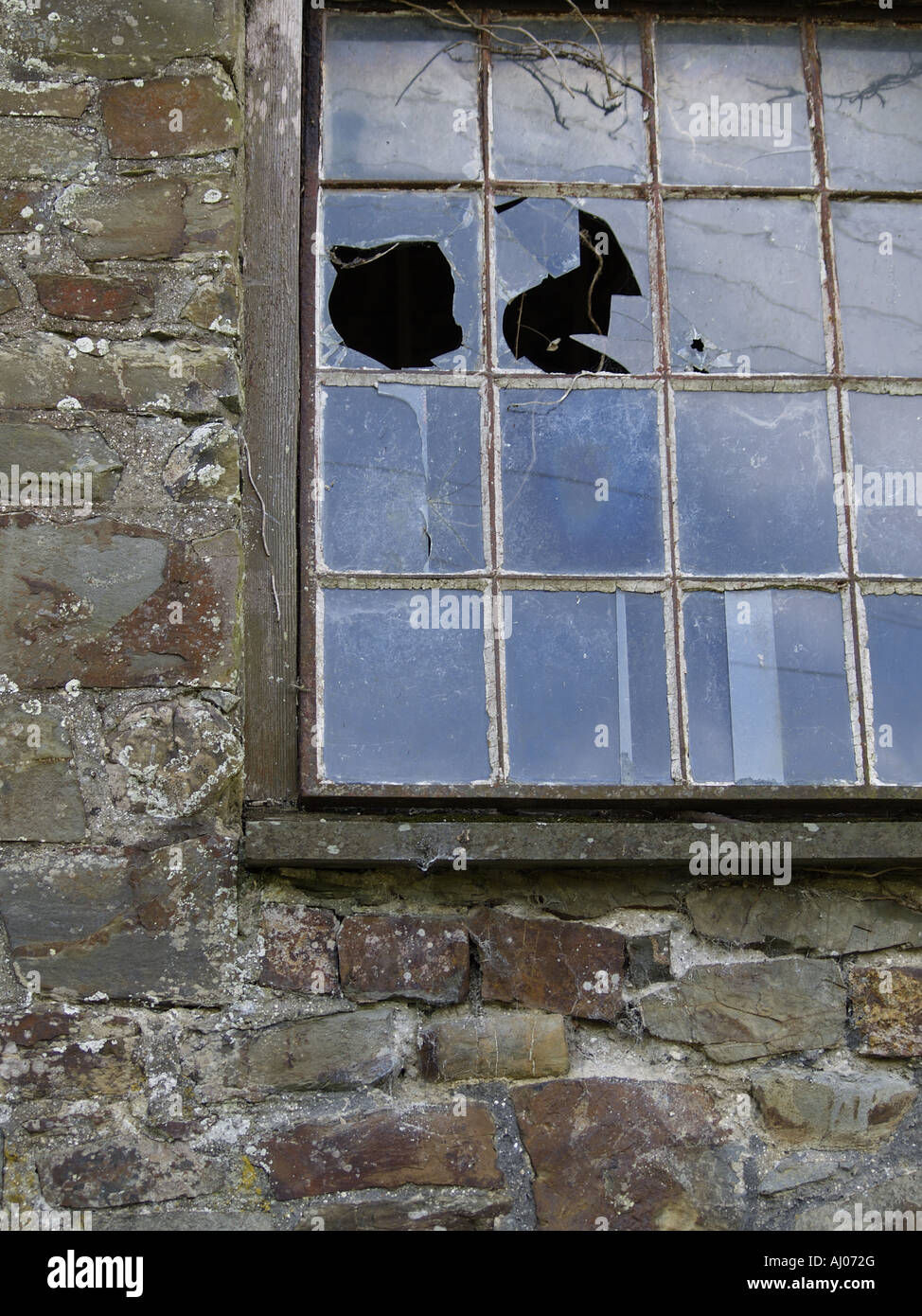 Broken window in an old stone wall Stock Photo - Alamy