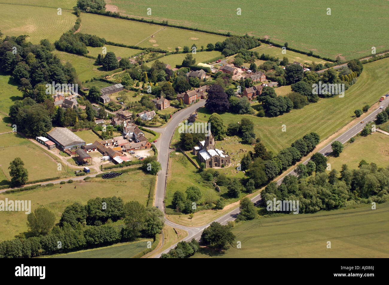 Aerial view of Tong Church and village off the A41 in Shropshire ...