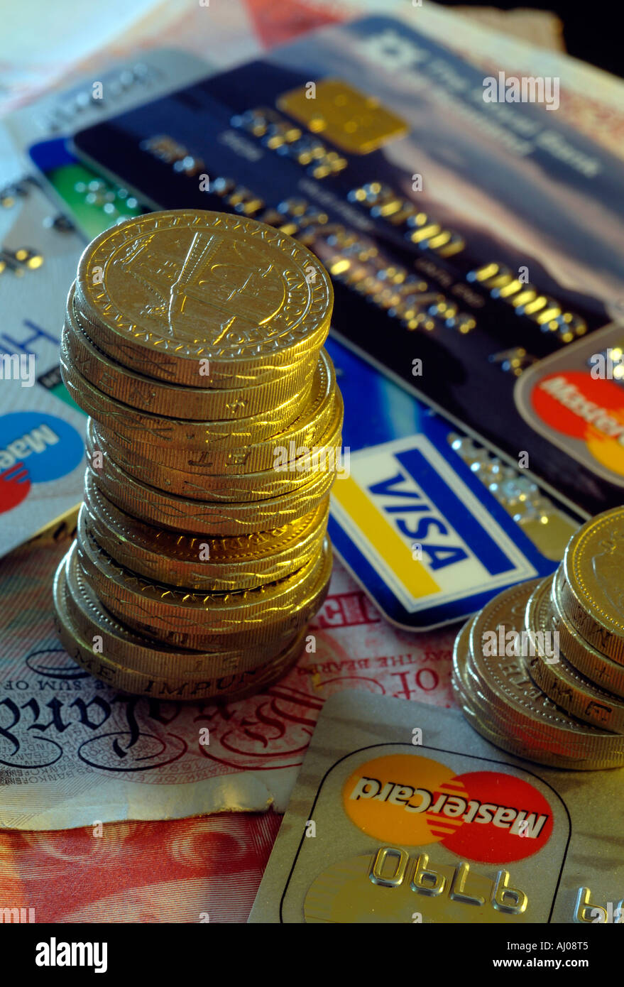 A pile of British pound coins, credit cards and fifty pound notes Stock ...