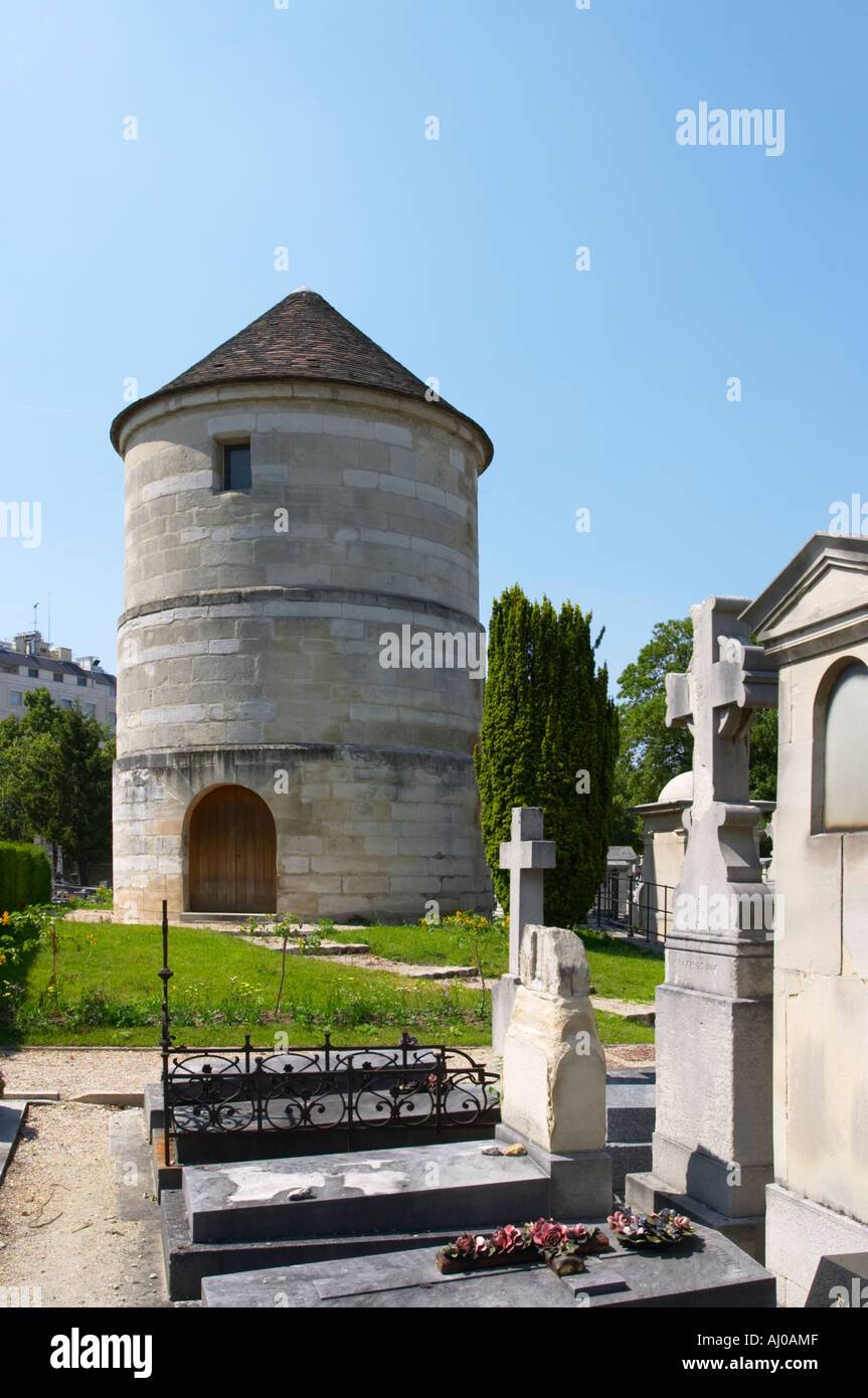 The remaining tower of an ancient windmill in Montparnasse Cemetery ...