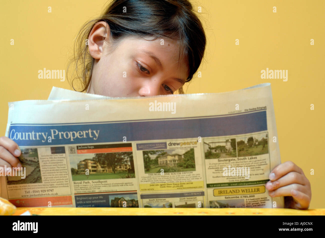 Hiding behind newspaper hi-res stock photography and images - Alamy