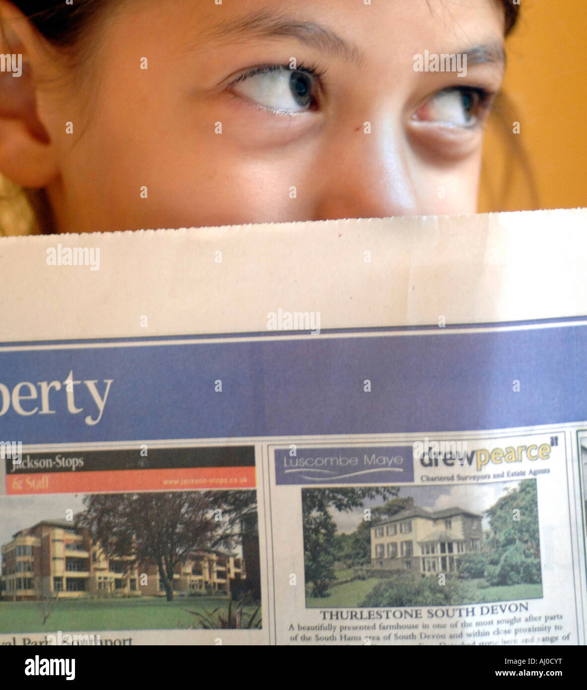 Hiding behind newspaper hi-res stock photography and images - Alamy
