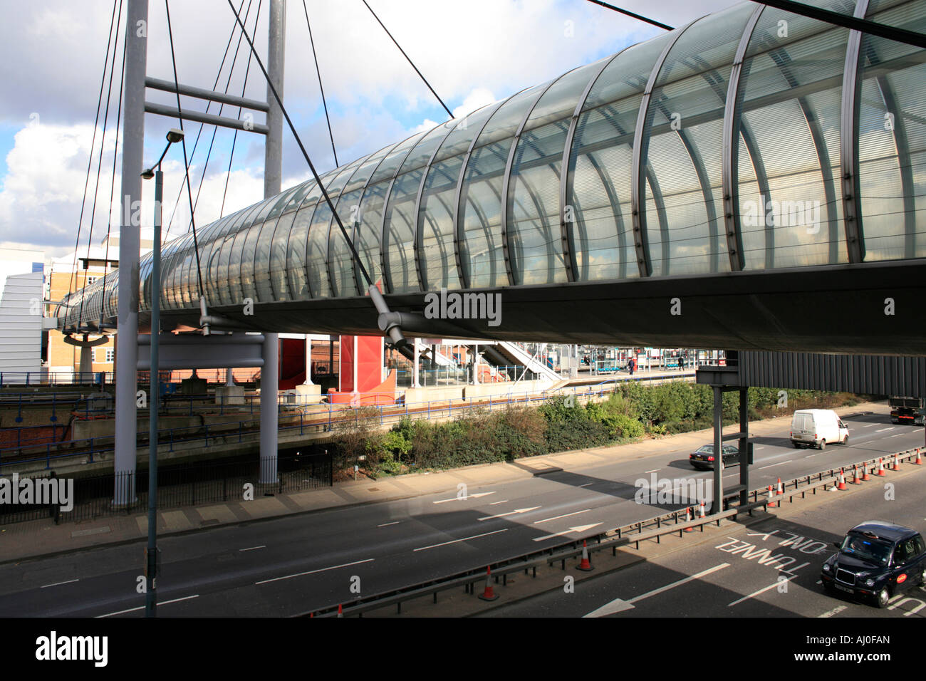 tubular footbridge over roadway canary wharf london docklands england ...