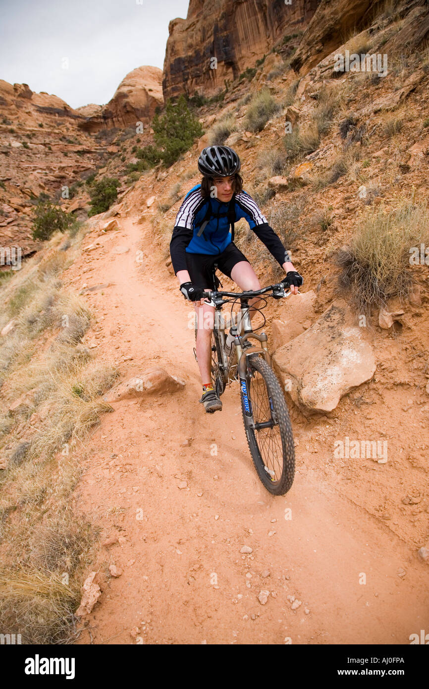 Teenage boys rides the Porcupine Rim Trail in Moab Utah mecca for ...
