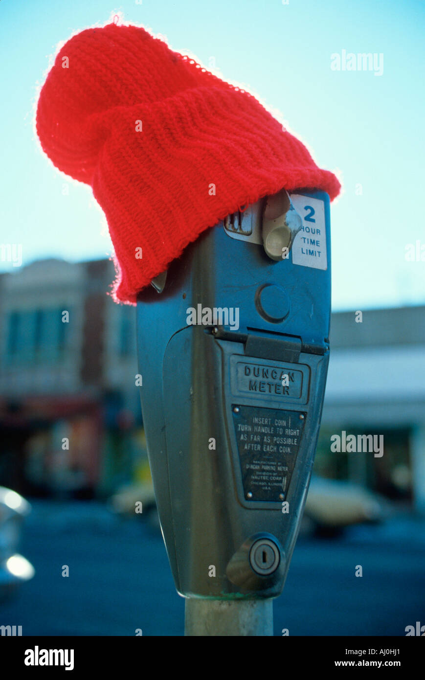 Parking meter wearing a red wool cap St Louis MO Stock Photo - Alamy