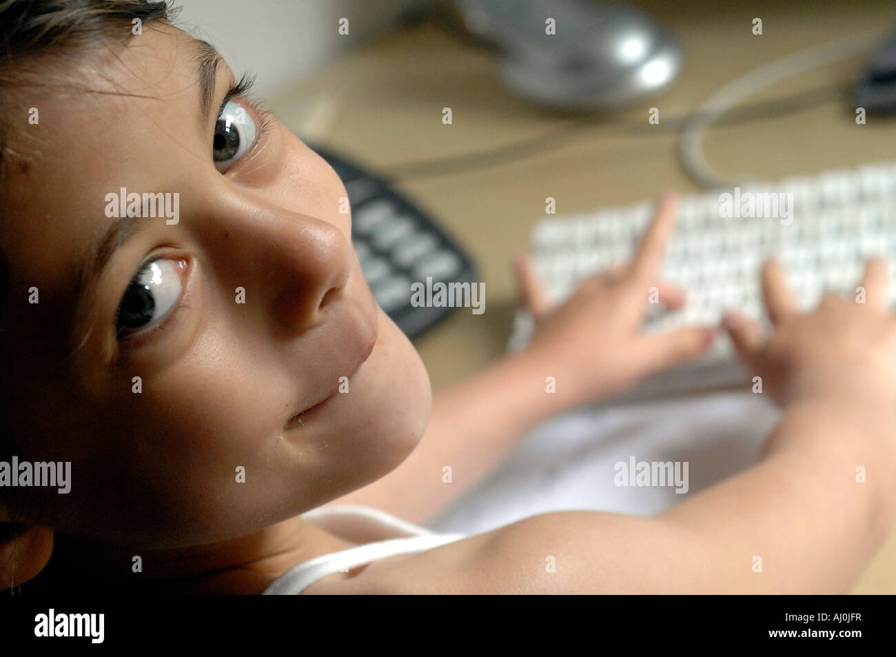 a young girl on a computer Stock Photo - Alamy