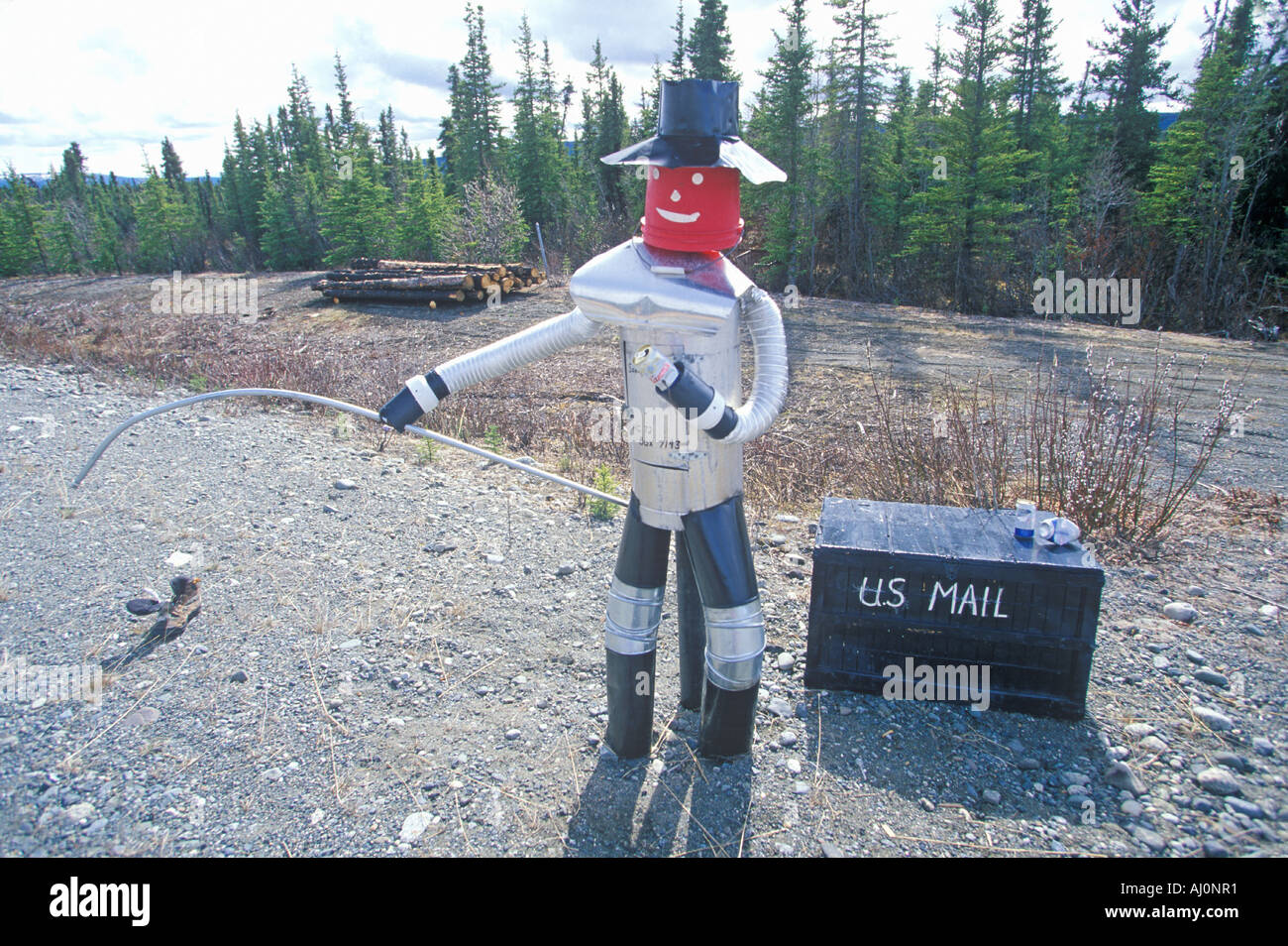 Statue of fisherman created of tin cans by mailbox AL Stock Photo - Alamy