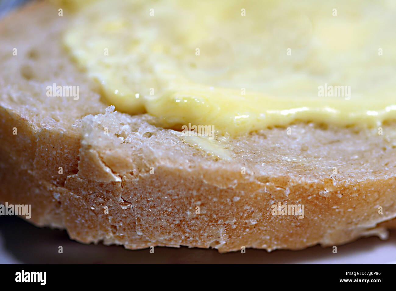 Golden Baked Bread With Melting Butter Stock Photo - Alamy