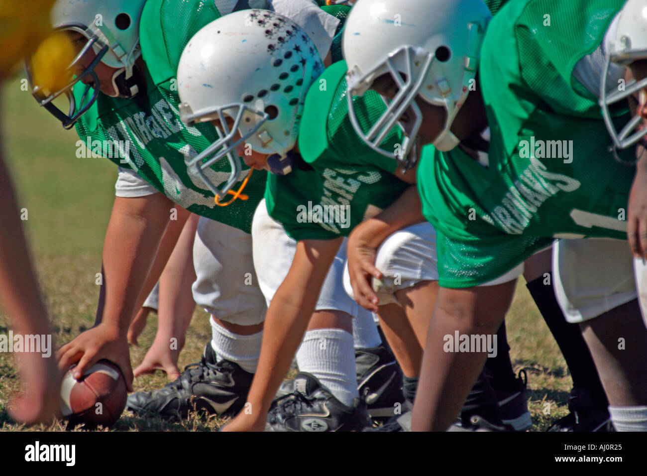 Photo of Youth Football in Action Play Stock Photo - Alamy