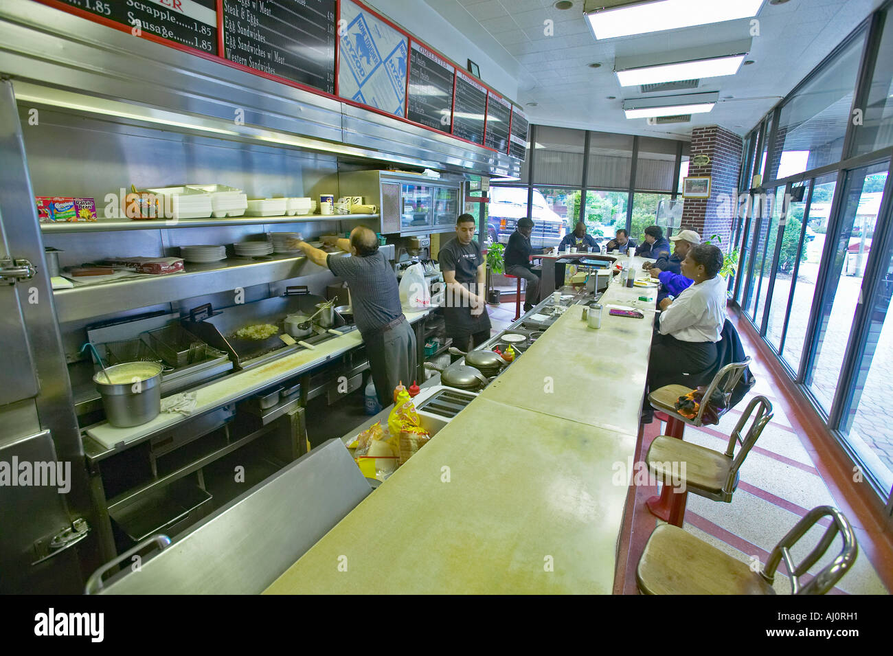 People eating breakfast at diner counter at old Waffle Shop in ...