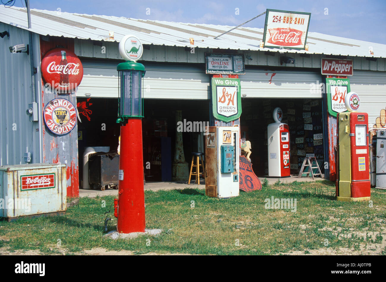 Antique gas station pumps and signs Central TX Stock Photo - Alamy