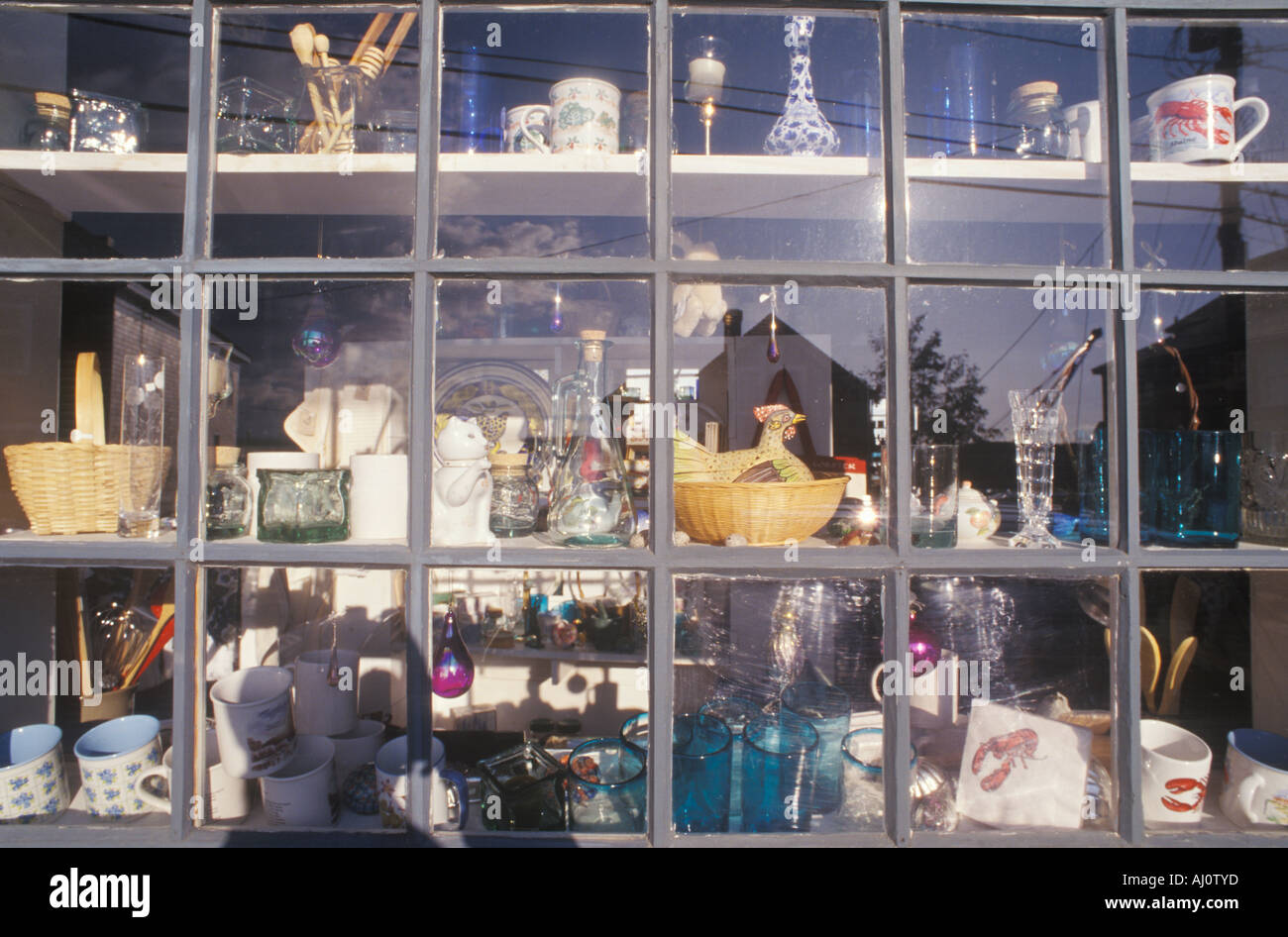 Thrift store items in window Stock Photo - Alamy