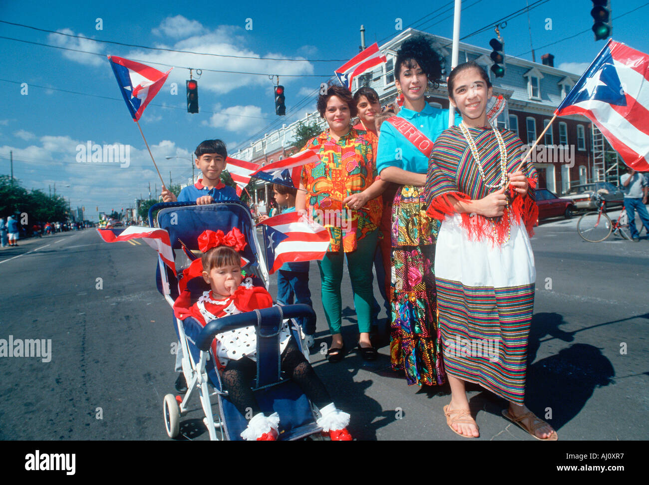 A Puerto Rican family with their national flag at a parade Wilmington ...