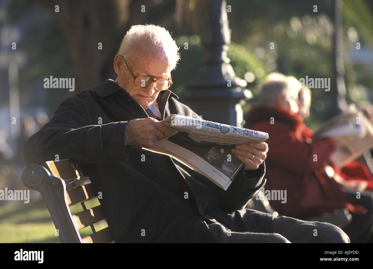 Reading a newspaper on the promenade Rapallo Ligury Italy Stock Photo ...