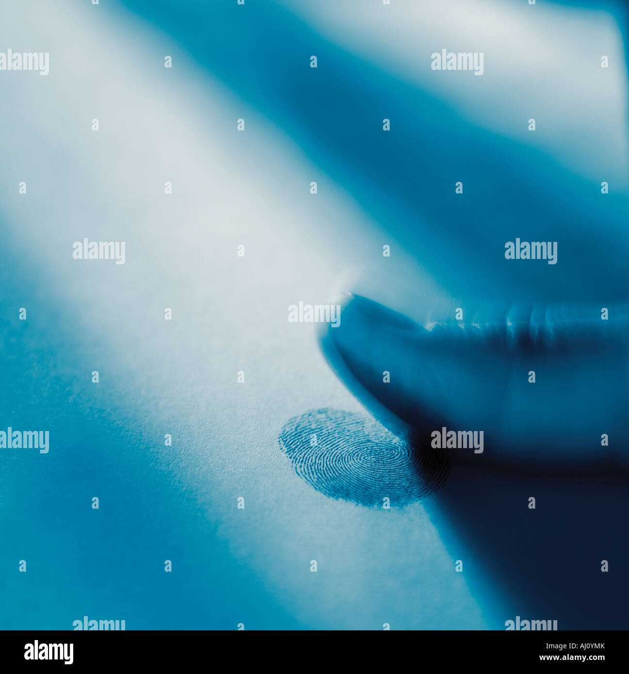 Fingerprint with dramatic lighting. Blue tinted Stock Photo - Alamy