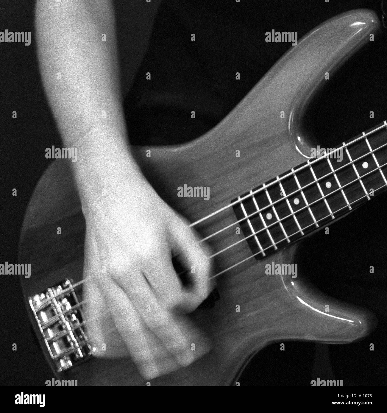 Hand holding a guitar Stock Photo - Alamy