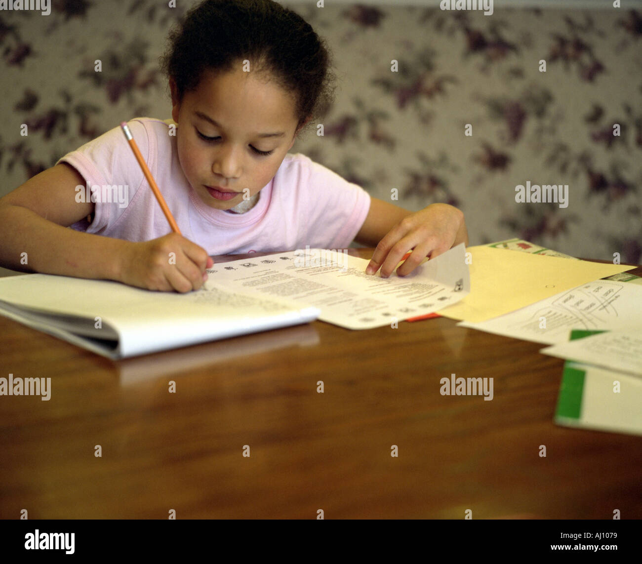 Young girl doing school work Stock Photo - Alamy