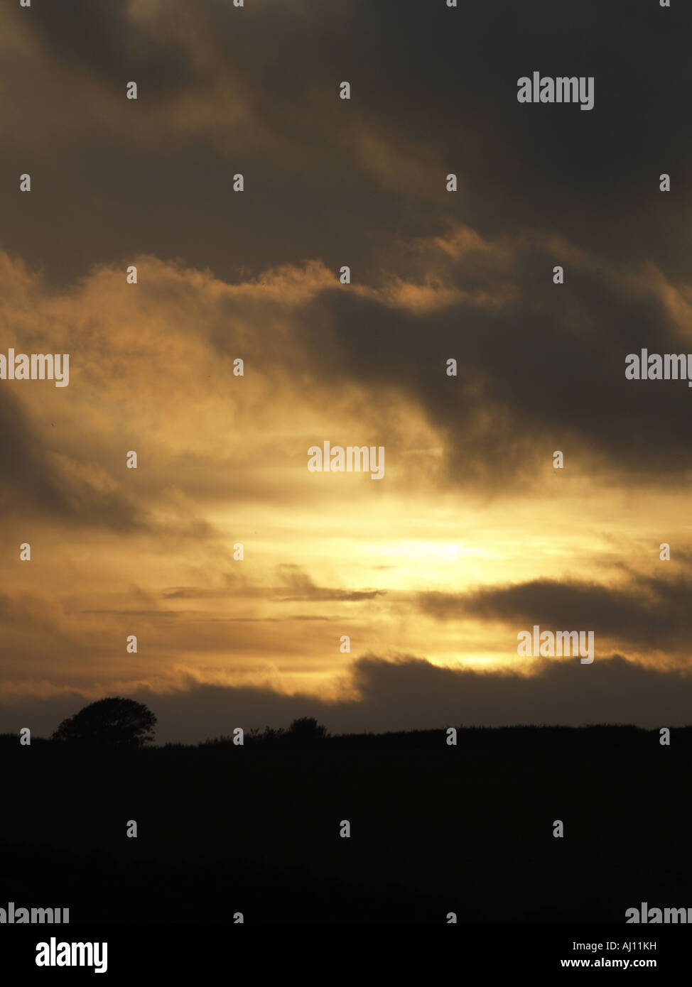 Storm clouds forming at sunset over Upper Tamar Lakes. Silhouette of ...