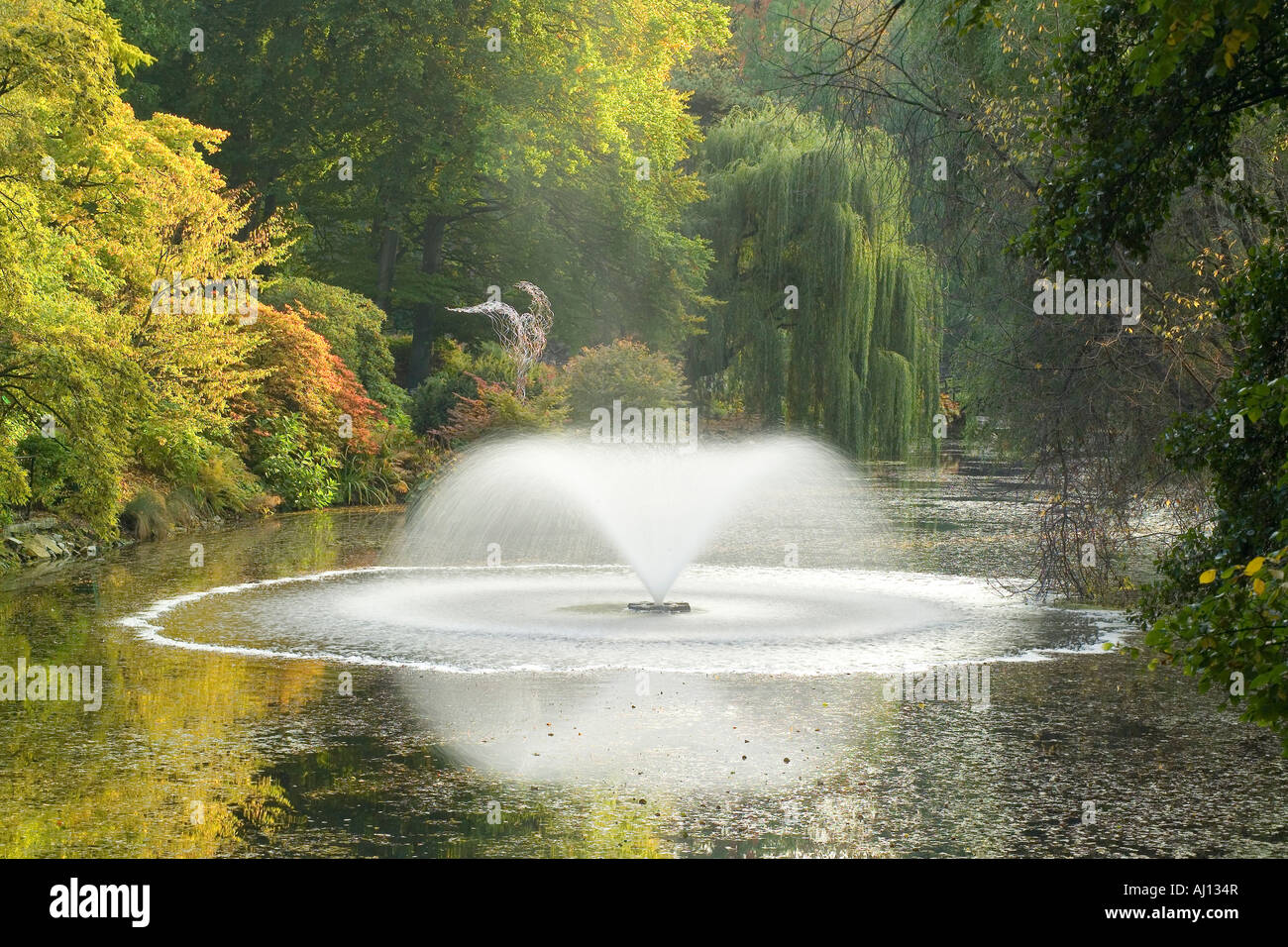 Fountain in autumn Stock Photo - Alamy
