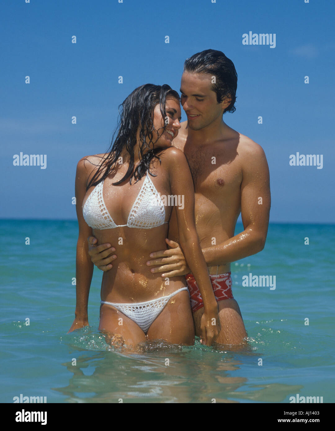 attractive young couple embracing at beach Stock Photo - Alamy attractive young couple embracing at beach Stock Photo - Alamy