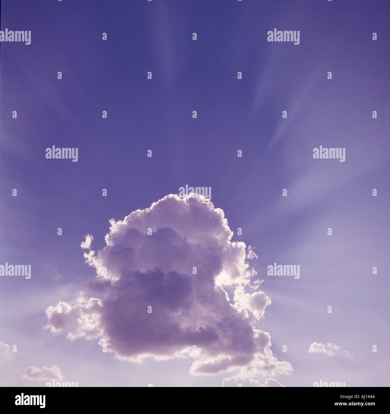 single cumulus cloud and sun rays Stock Photo - Alamy