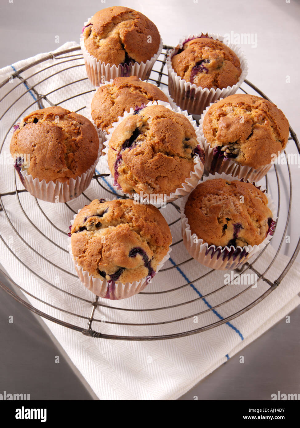 home made muffins on a wire cooling rack editorial food Stock Photo - Alamy