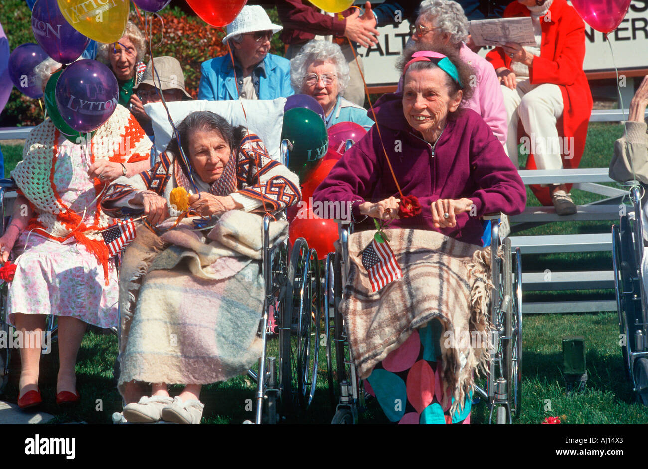 A group of elderly women in wheelchairs watching a parade Northern CA ...