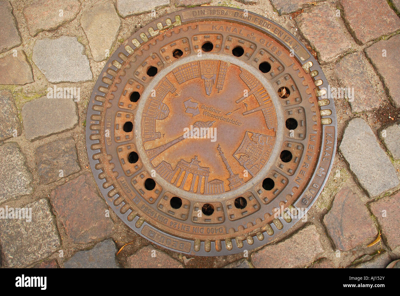 Manhole cover with objects of interest Berlin Germany Stock Photo - Alamy