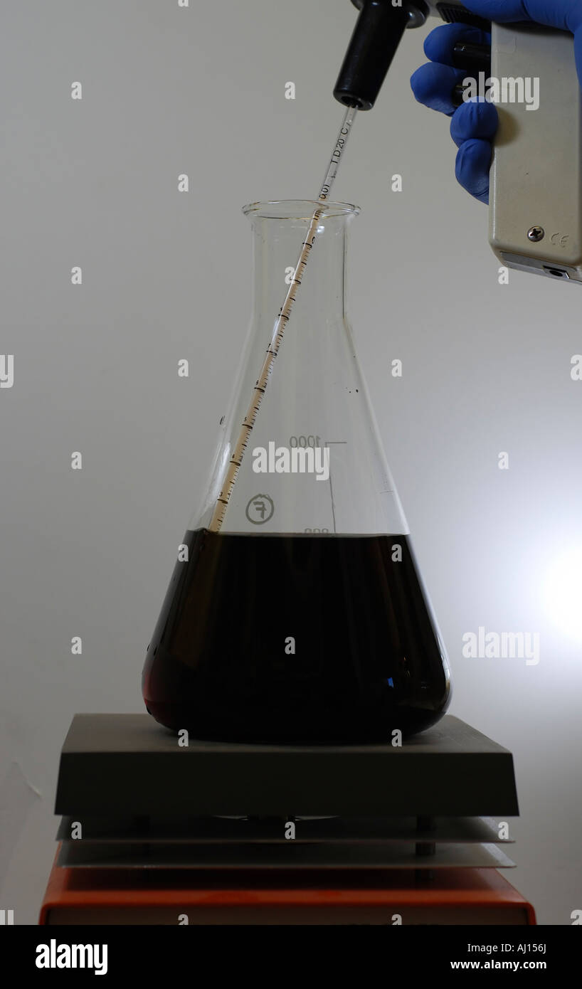 Sampling chemical compounds with a Beaker and Pipette Stock Photo - Alamy