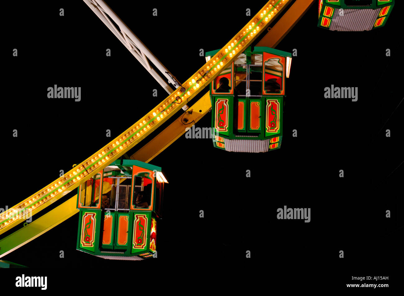 Cabins on Ferris wheel at night Stock Photo - Alamy
