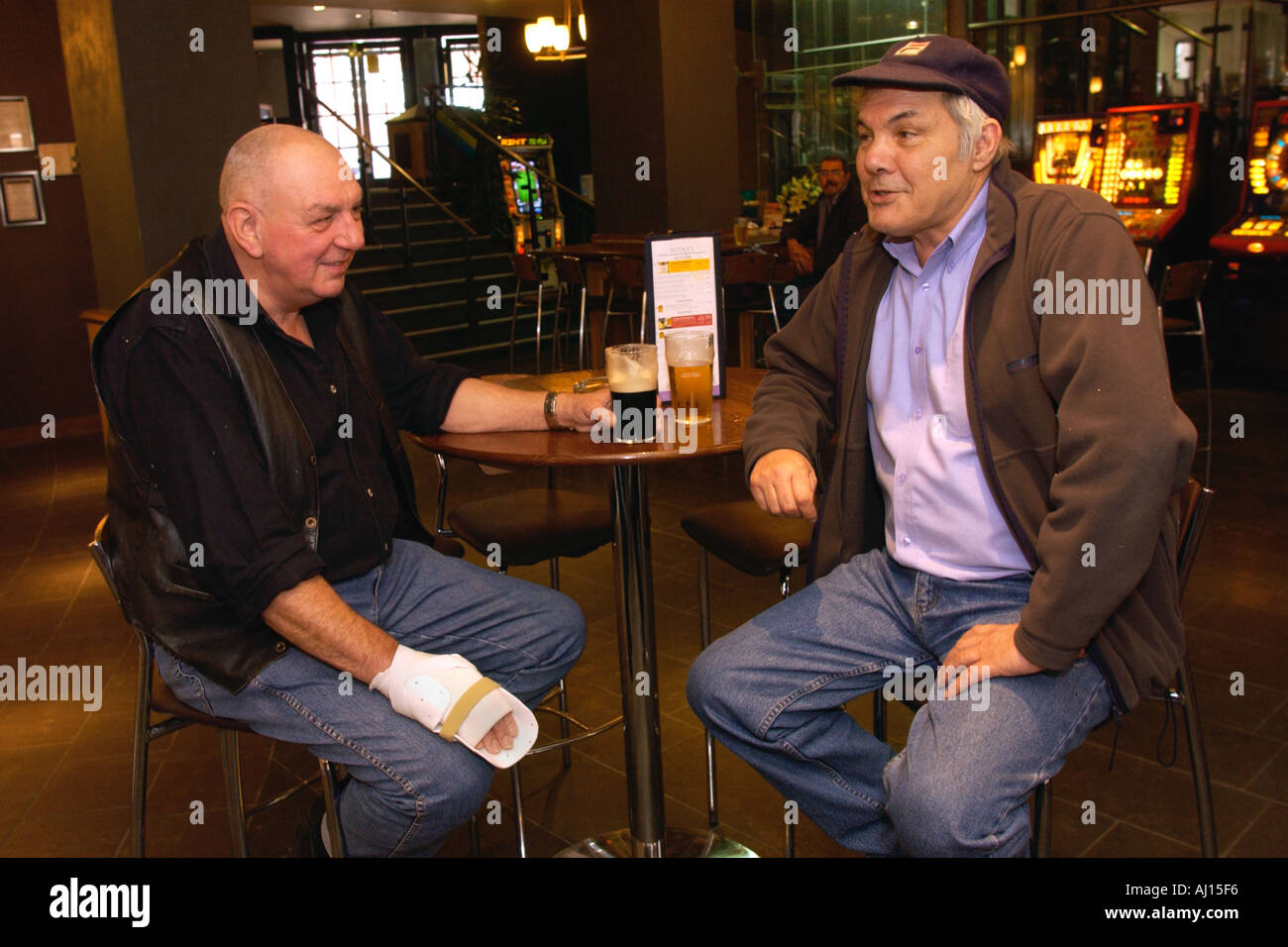 Two local men drinking beer in The Gatekeeper pub in Cardiff South ...