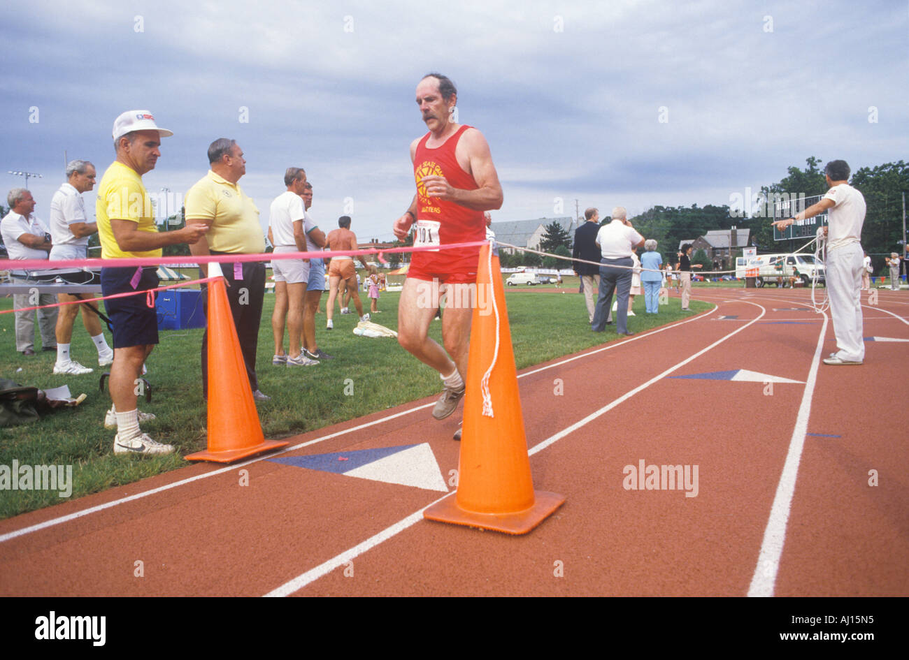 Runner crosses the finishing line at the Senior Olympics St Louis MO ...