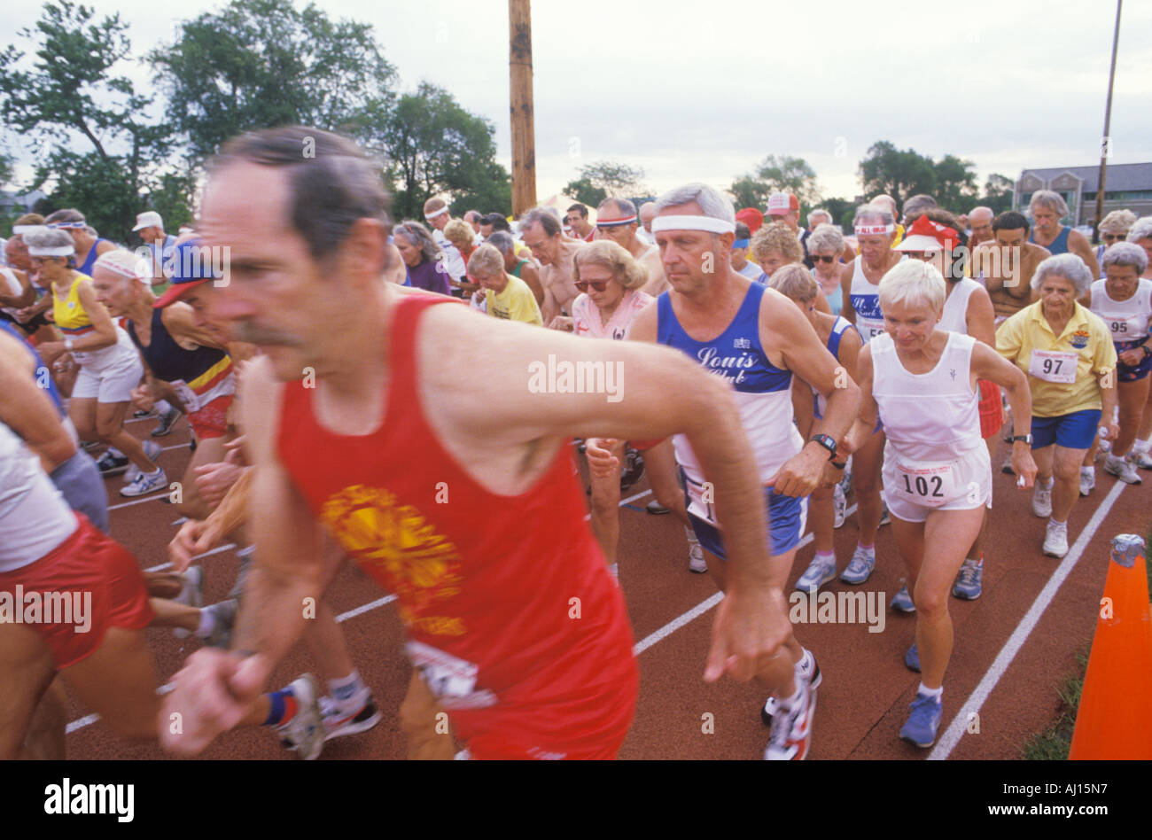 Runners crossing the starting line for the Senior Olympics St Louis MO ...