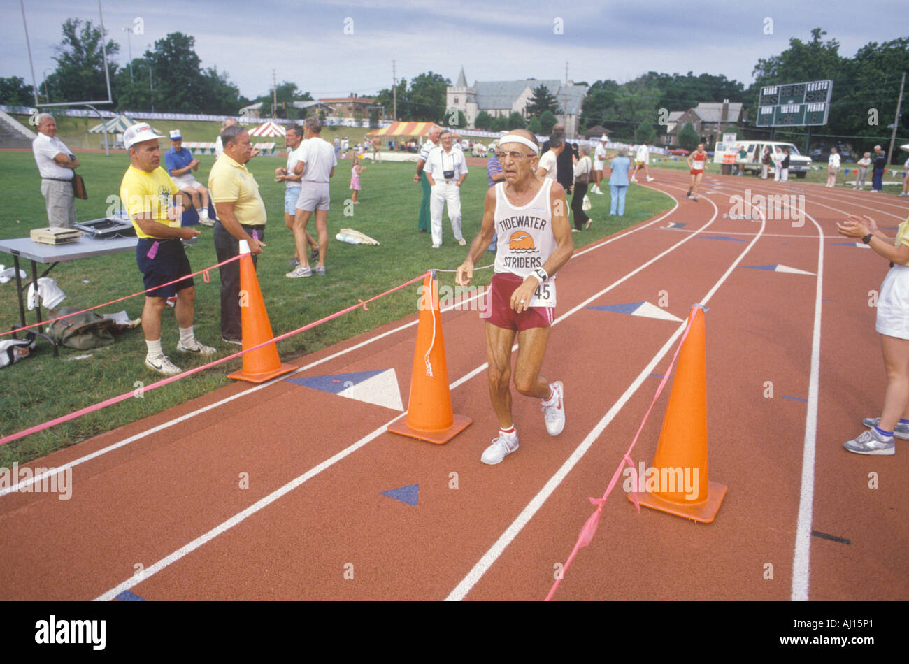 Runner crosses the finishing line at the Senior Olympics St Louis MO ...