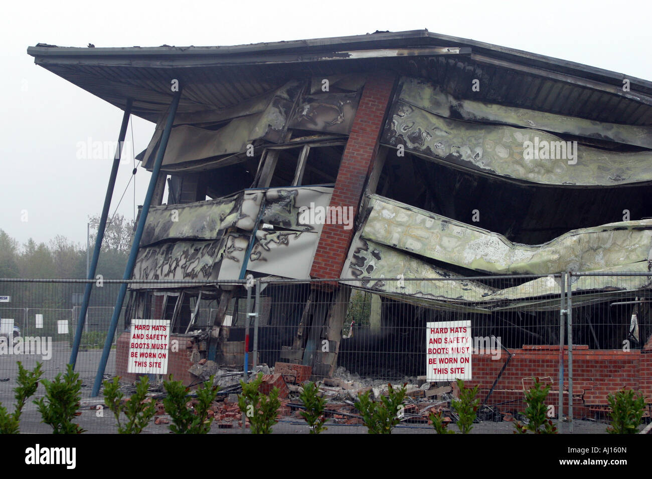 danger keep out sign warning of a building severely damaged by fire ...