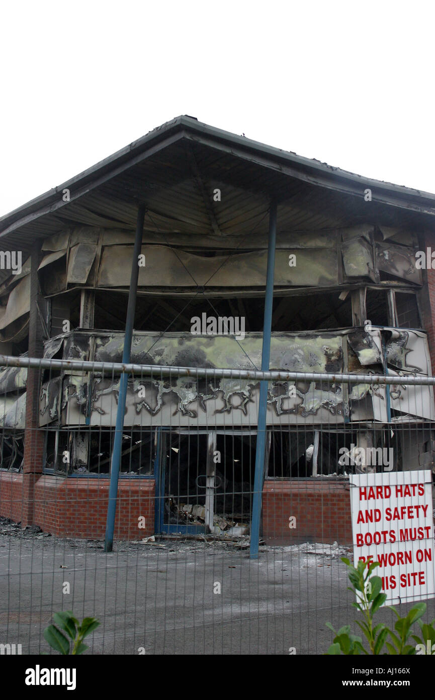 danger keep out sign warning of a building severely damaged by fire ...
