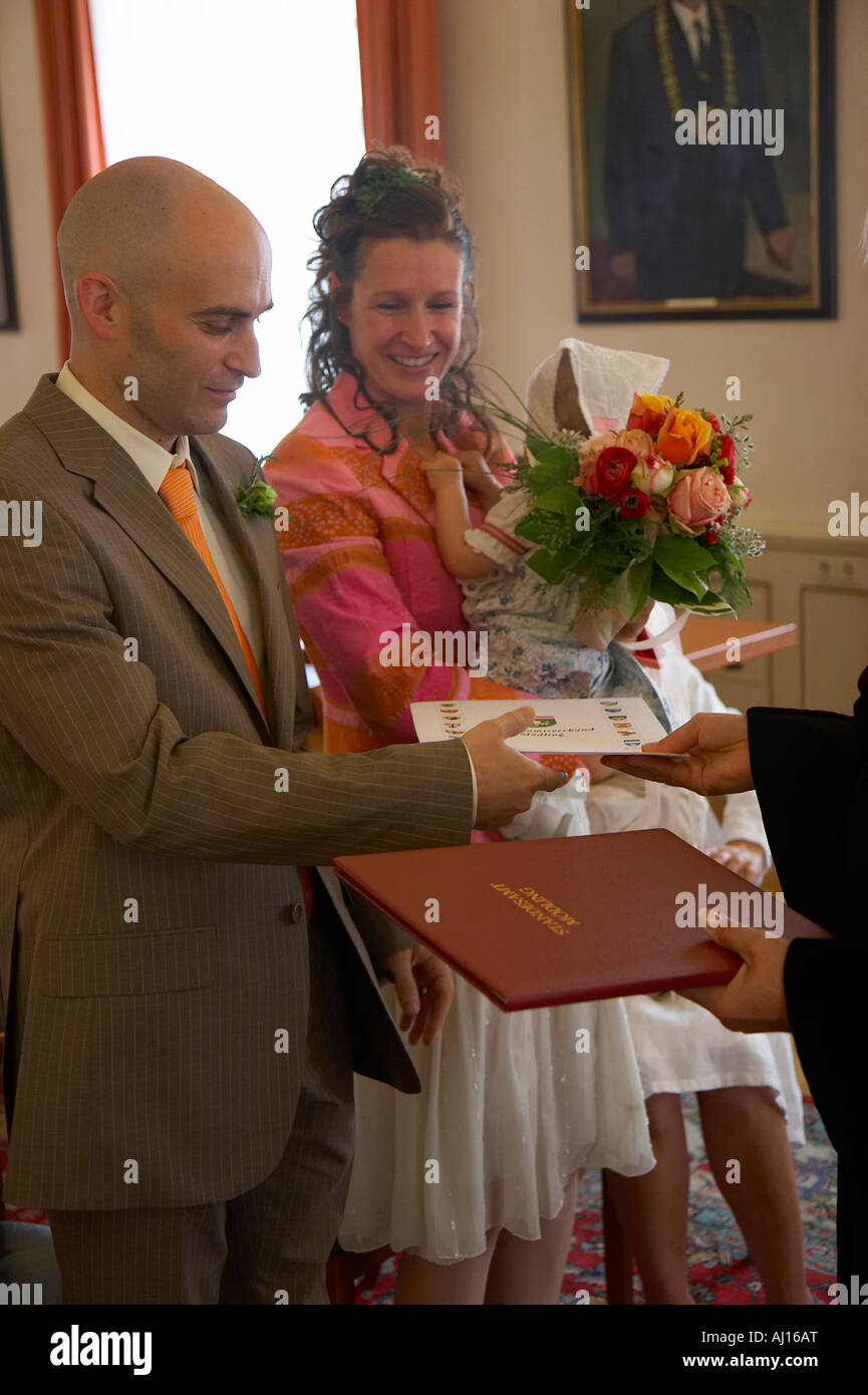 bridal couple with certificate of marriage Stock Photo - Alamy