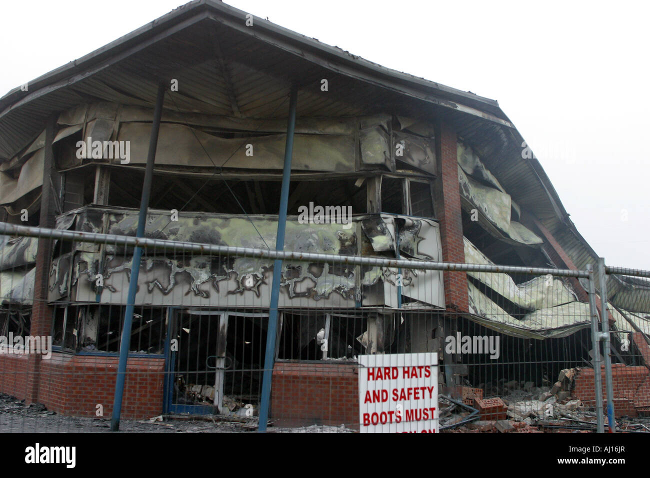 danger keep out sign warning of a building severely damaged by fire ...