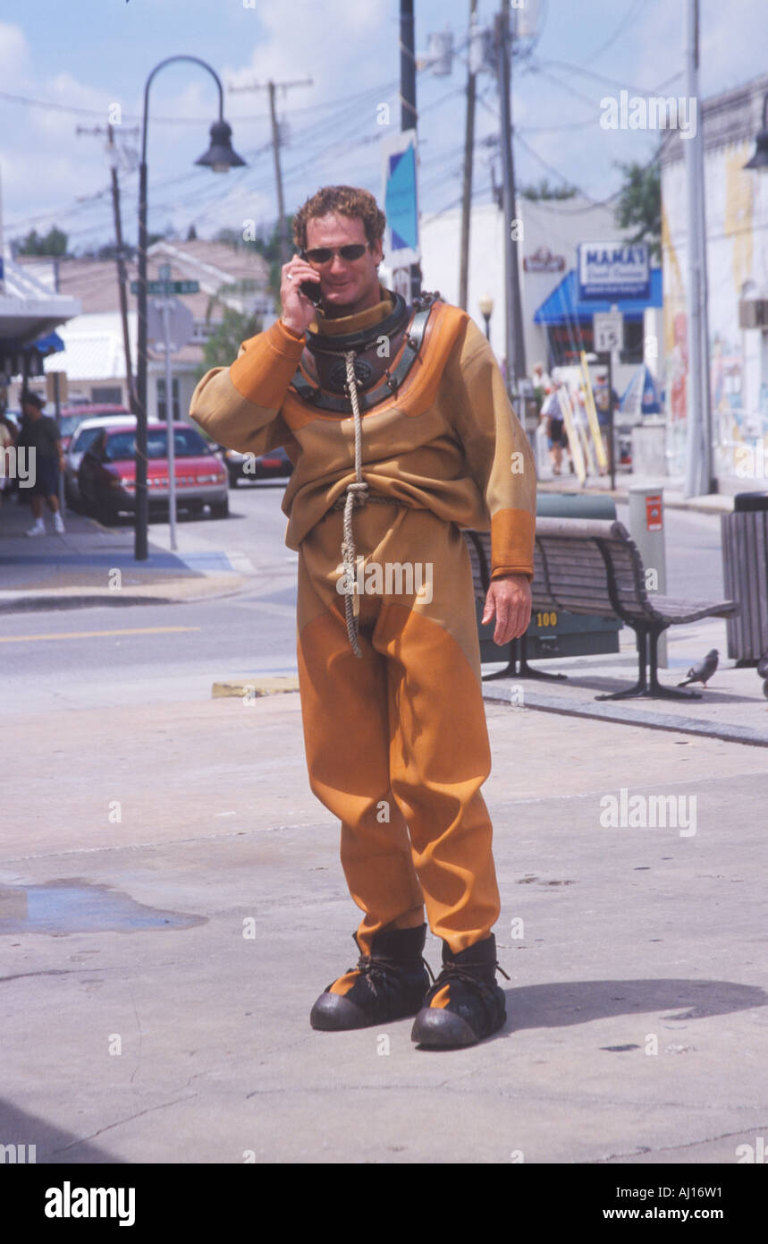 Greek sponge diver talks on cell phone with historic diving suit in ...