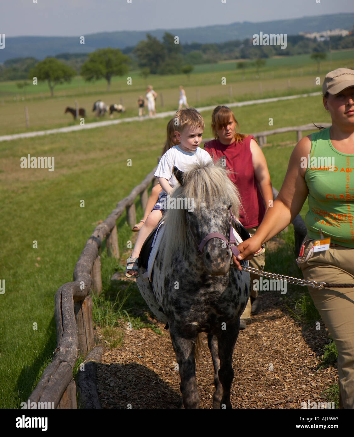 child riding on pony Stock Photo - Alamy