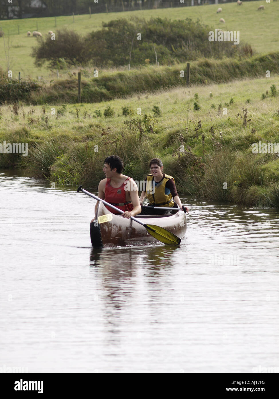 Man and woman, paddling on Bude canal in a canoe Stock Photo - Alamy