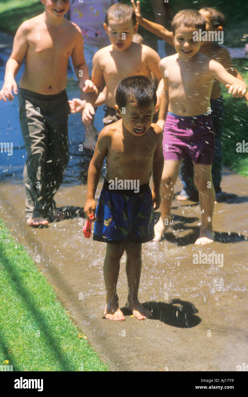 Children playing water balloons hi-res stock photography and images - Alamy