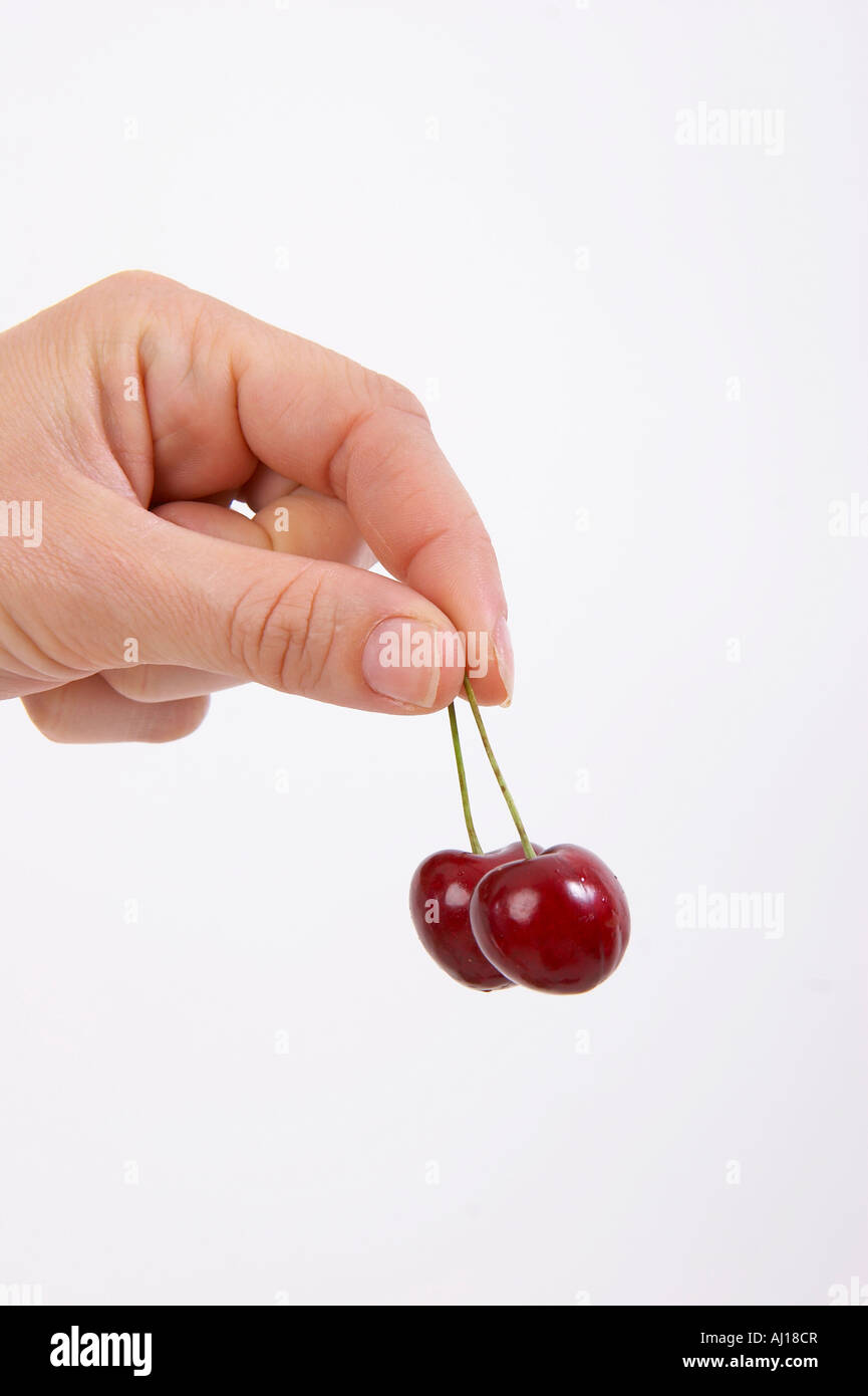 hand holding cherries Stock Photo - Alamy