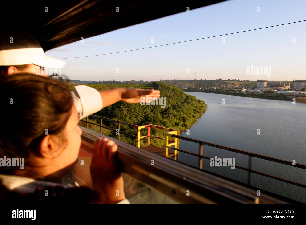 Girls on a train window pointing Romania Stock Photo - Alamy