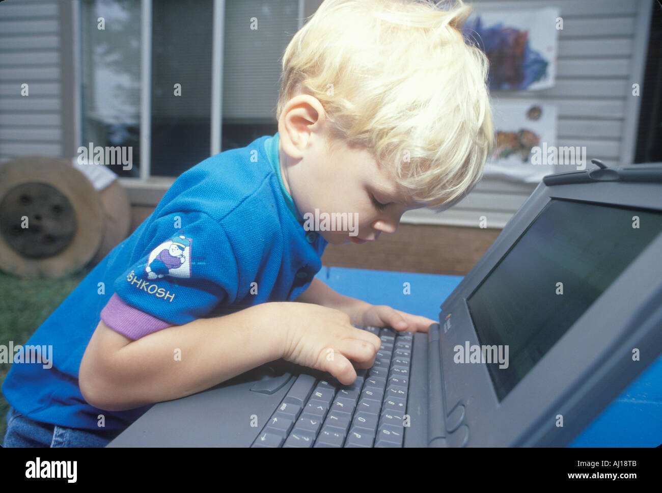 A boy learning to use a laptop computer in Washington D C Stock Photo ...