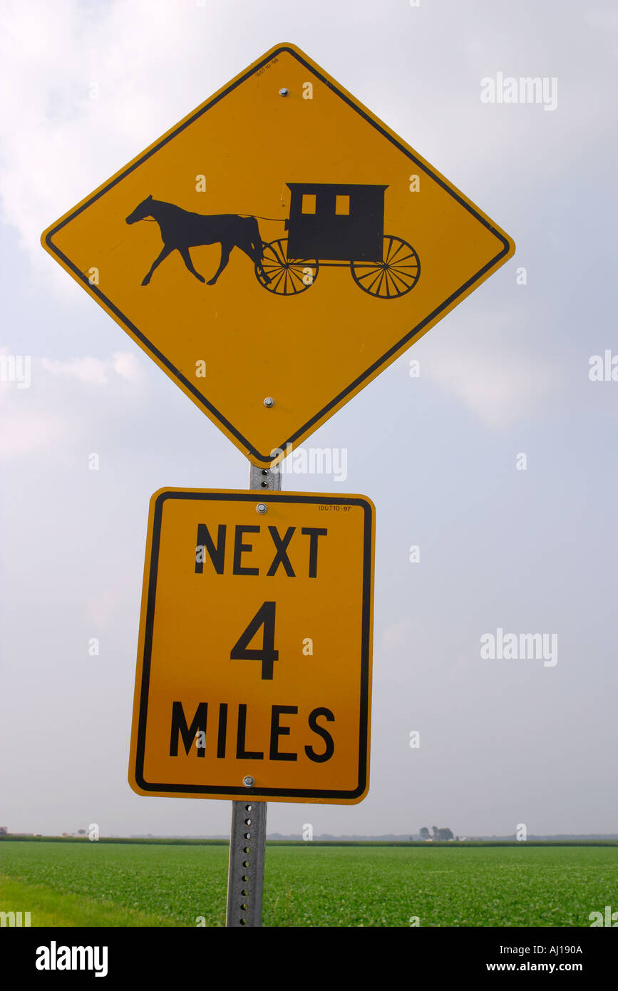 ILLINOIS Arthur Amish buggy silhouetted on road sign Stock Photo - Alamy